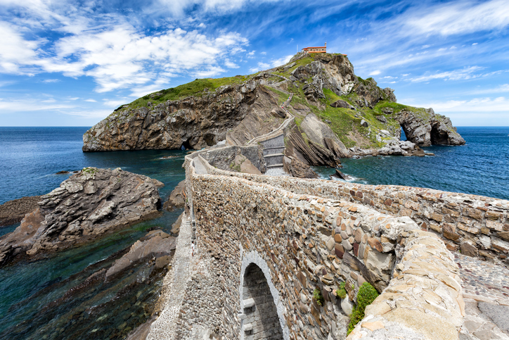 An island off northern Spain with a small church perched on top is the ...