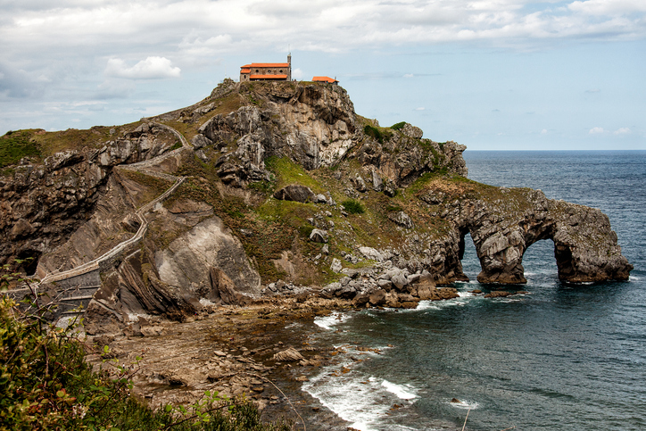 An island off northern Spain with a small church perched on top is the ...